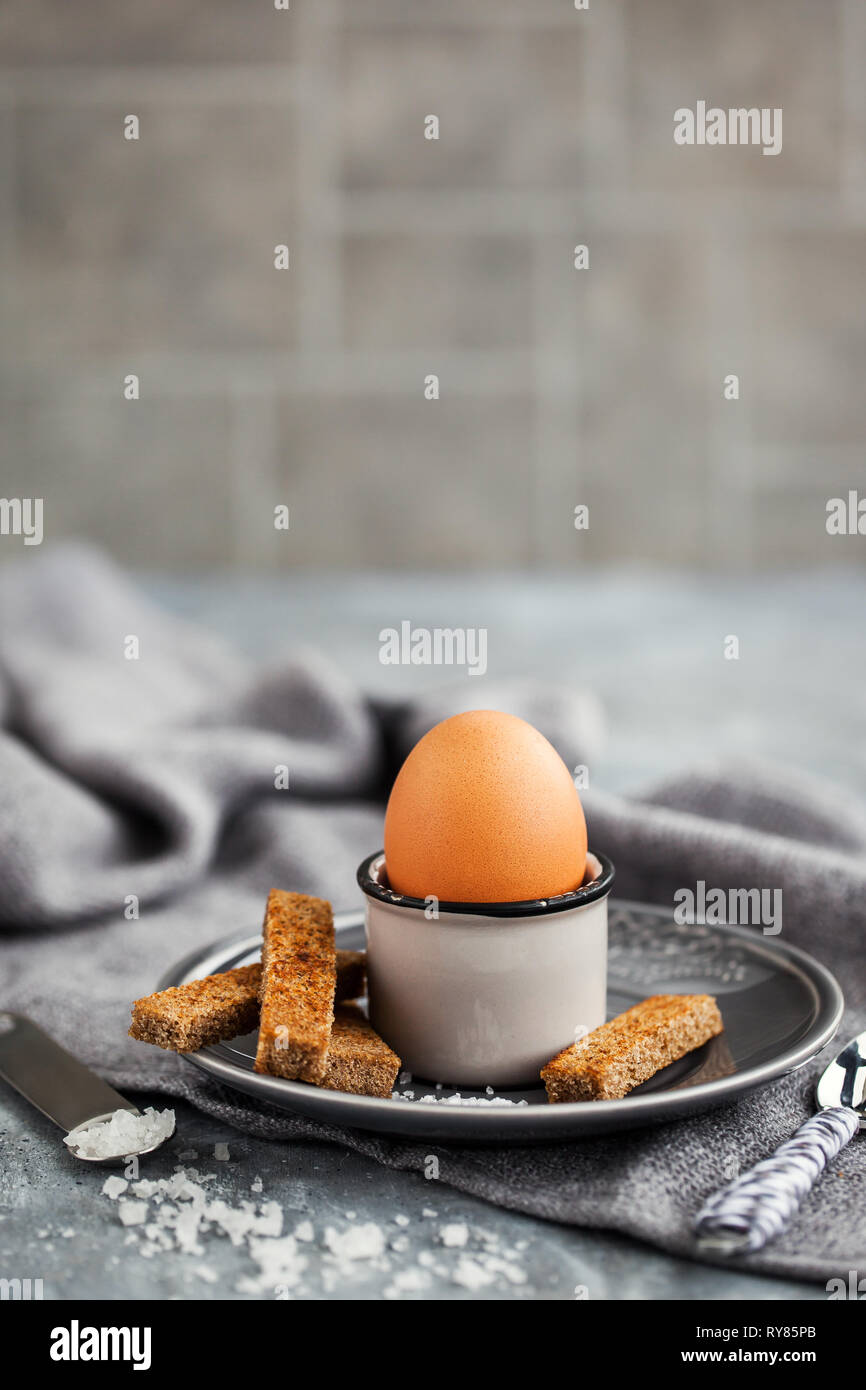 Boiled egg with rye toasts for breakfast Stock Photo - Alamy
