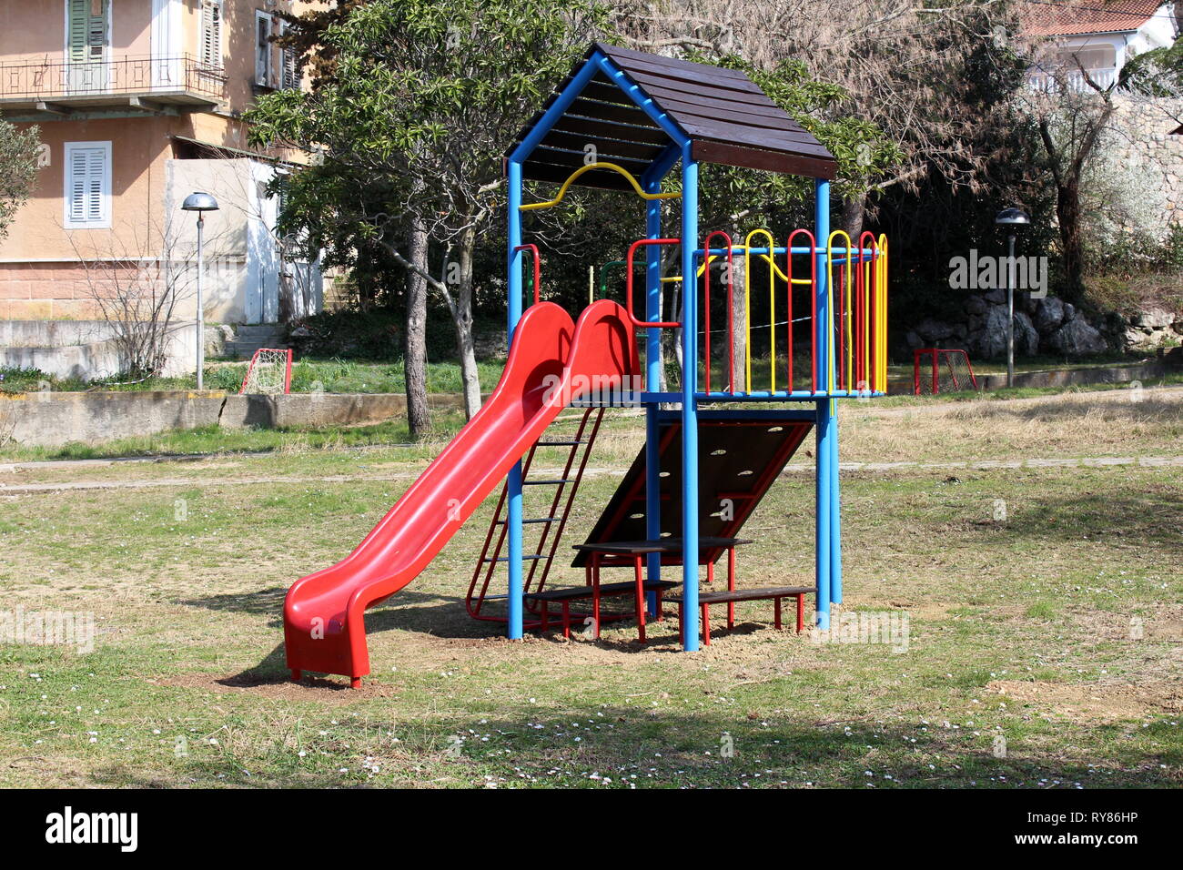 Outdoor wooden and metal public playground equipment with climbing ...