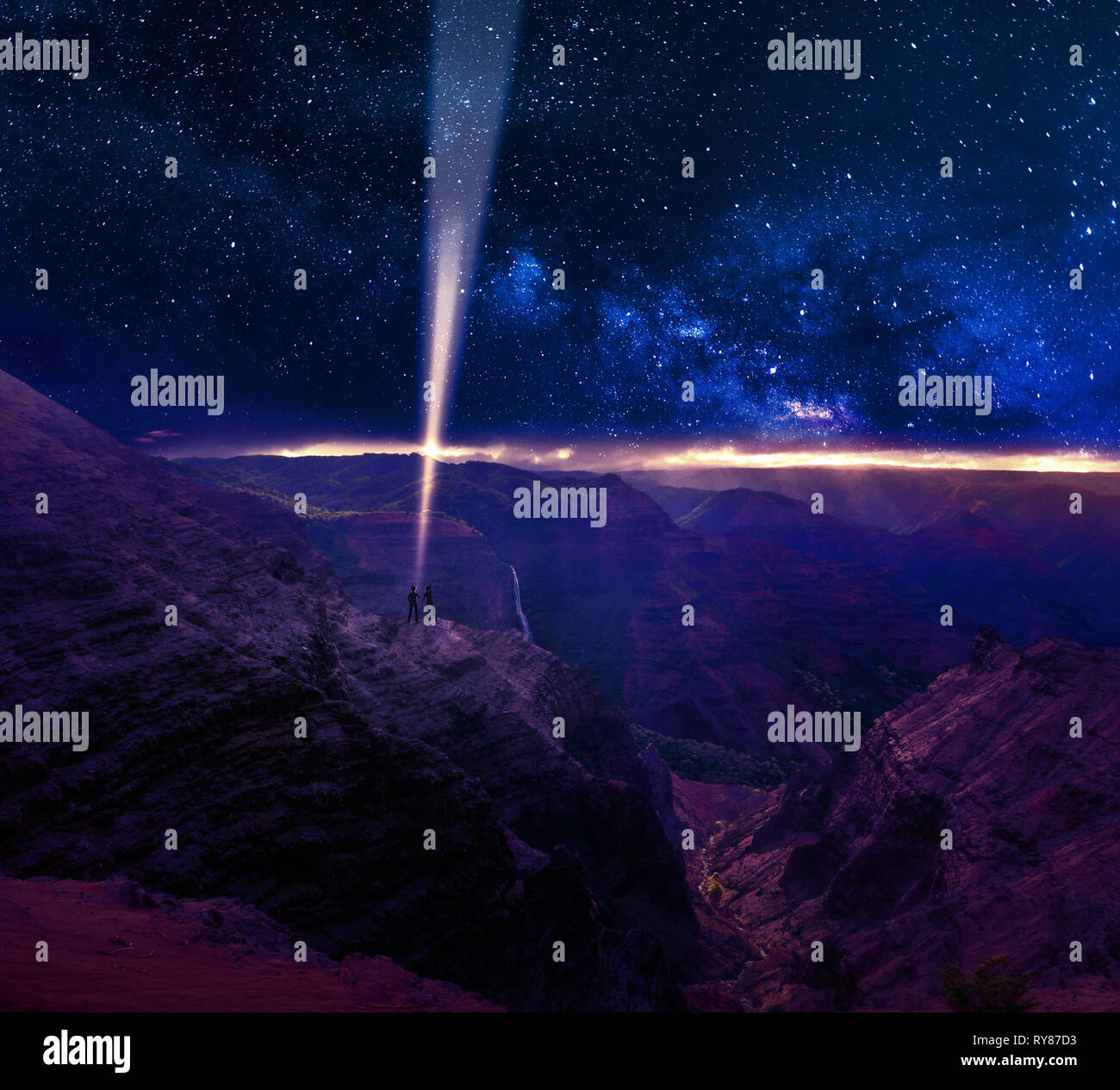 Two persons sending a light beam signal into outer space. Concept for ...