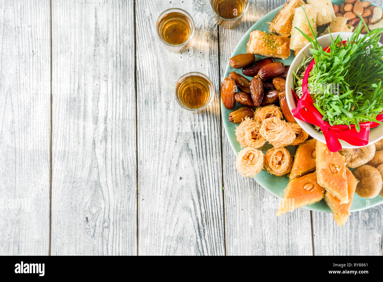 Happy Nowruz holiday background. Celebrating Nowruz sweets and treats ...