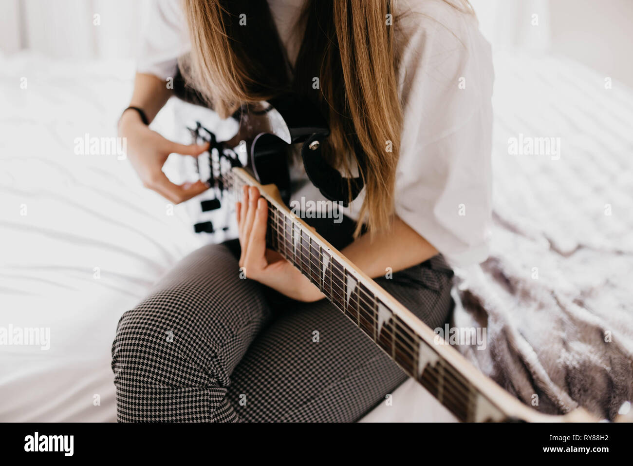 Young brunette Woman playing guitar Stock Photo - Alamy