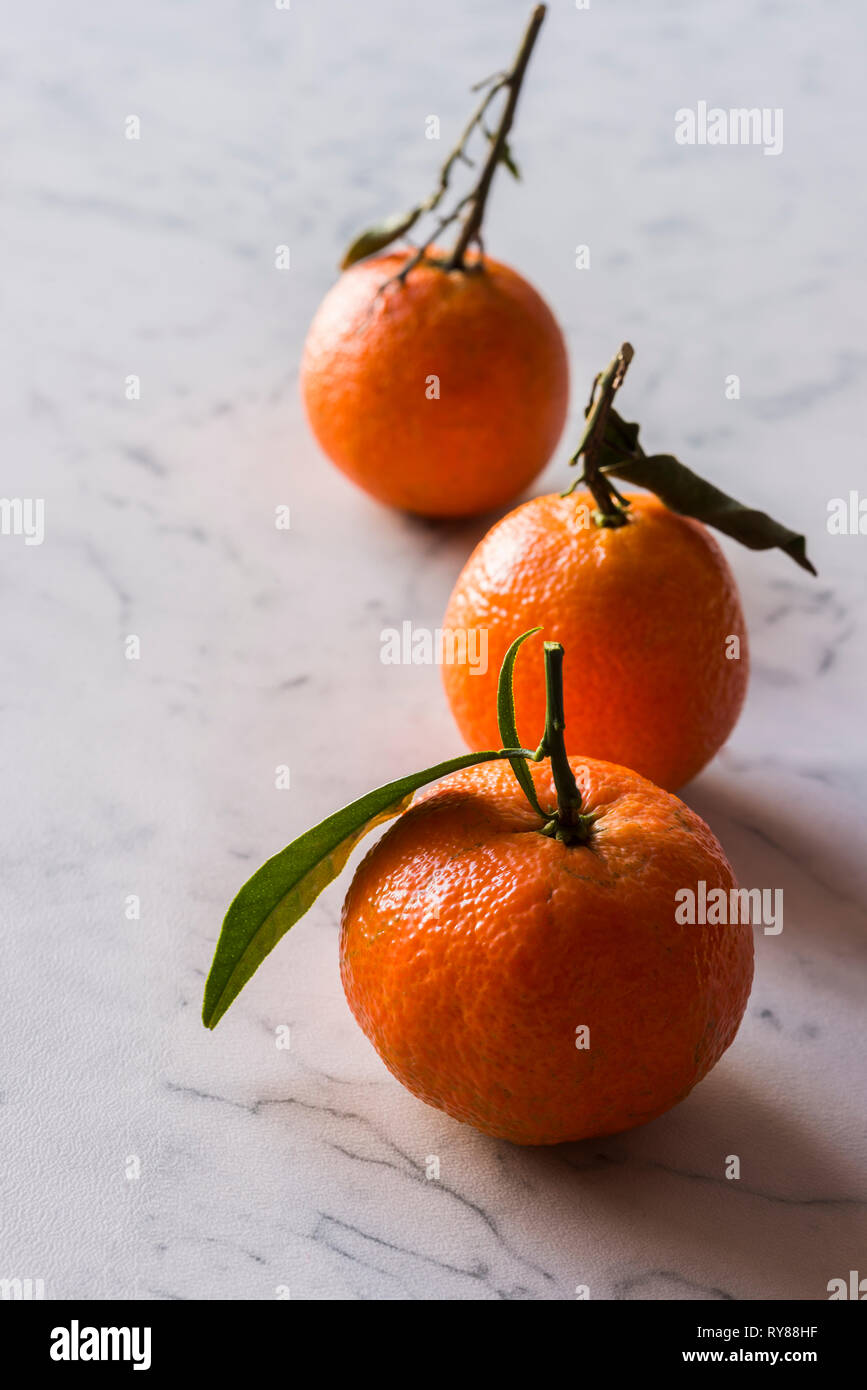 Three tangerines with leaves hi-res stock photography and images - Alamy