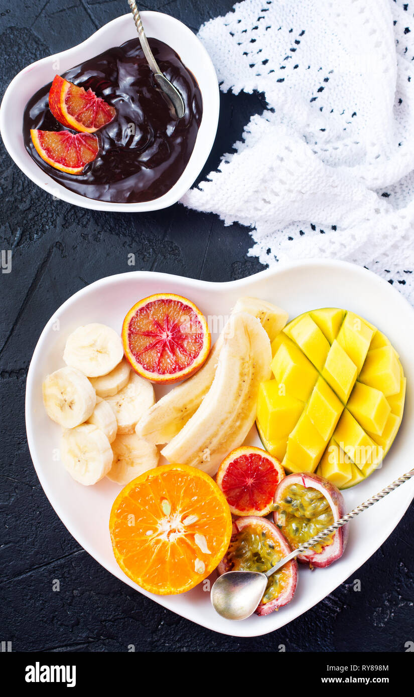 Healthy and fresh fruits on a plate Stock Photo - Alamy
