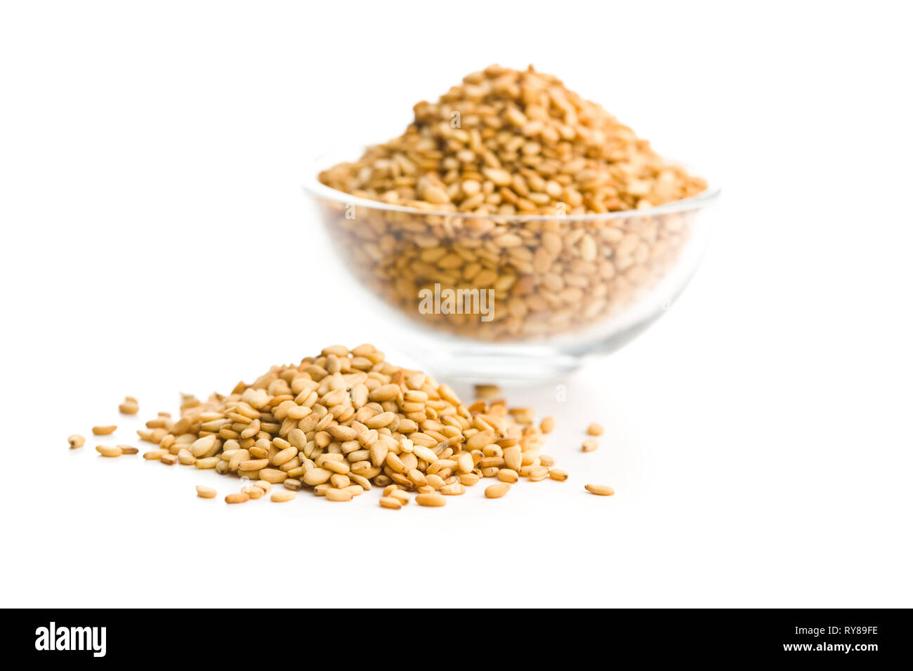 Roasted sesame seeds isolated on white background Stock Photo - Alamy