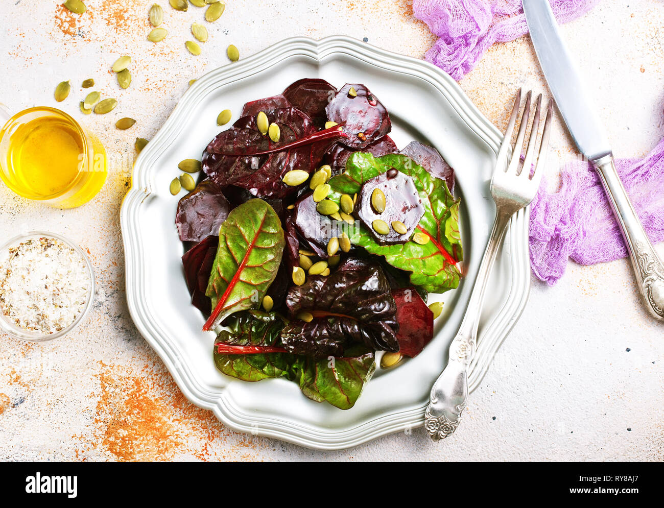 beet salad with nuts on metal plate Stock Photo - Alamy