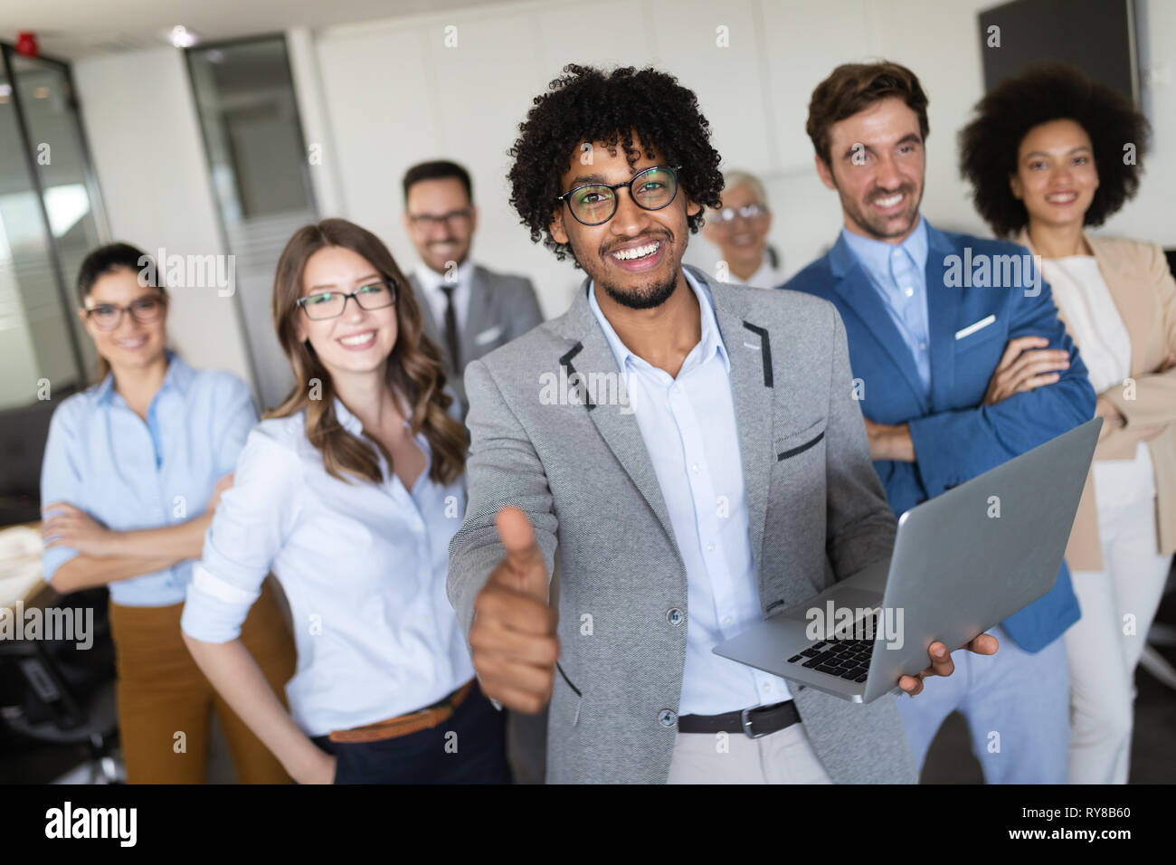 Business team celebrating a good job in the office Stock Photo - Alamy