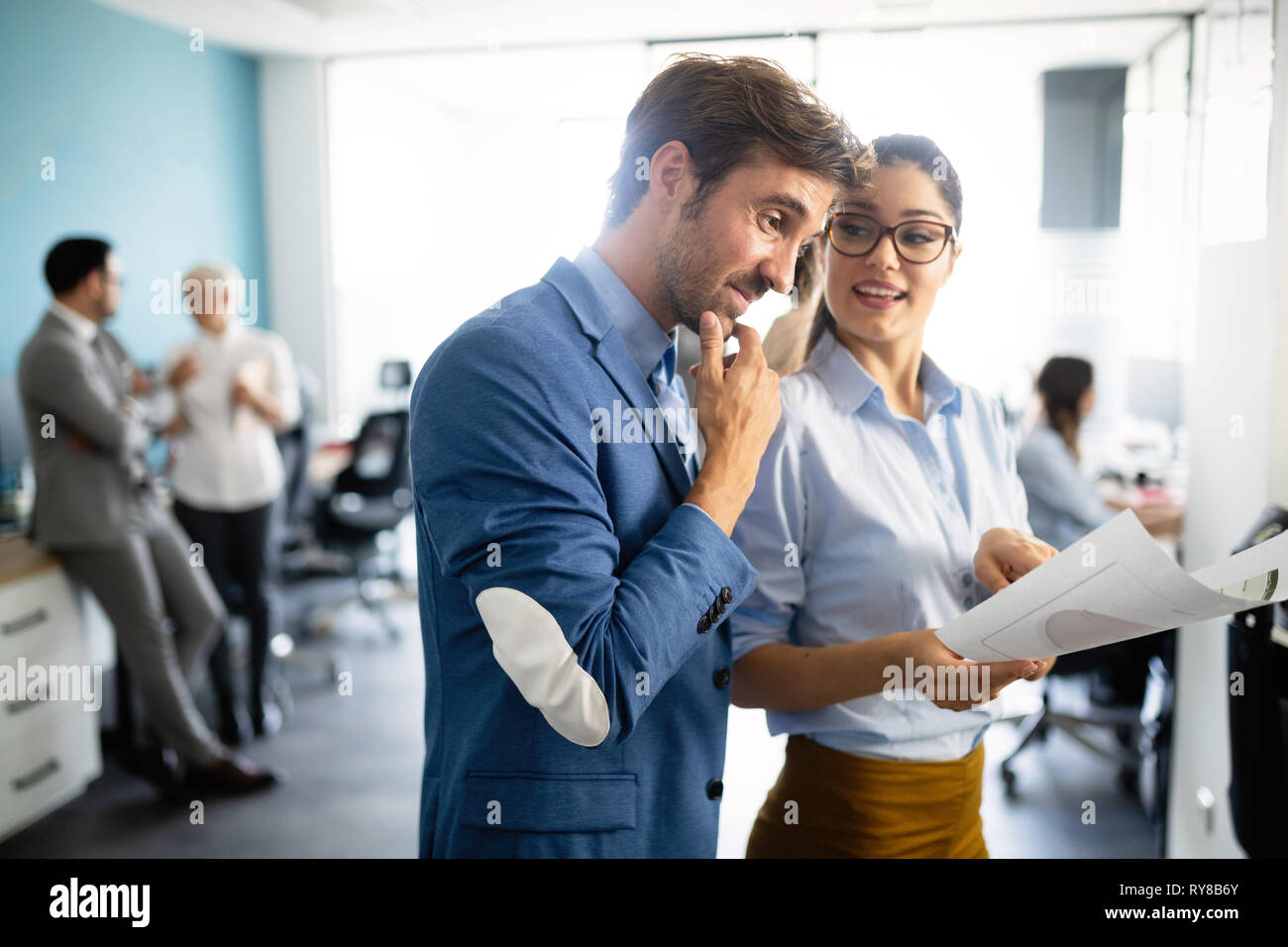 Group of successful business people at work in office Stock Photo - Alamy