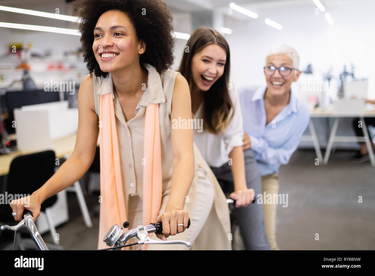 Group of multiethnic business people having corporate fun in office ...