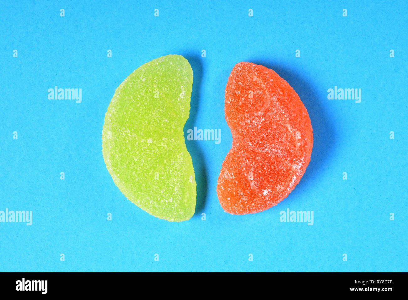 orange and lemon jelly candy on blue background Stock Photo - Alamy