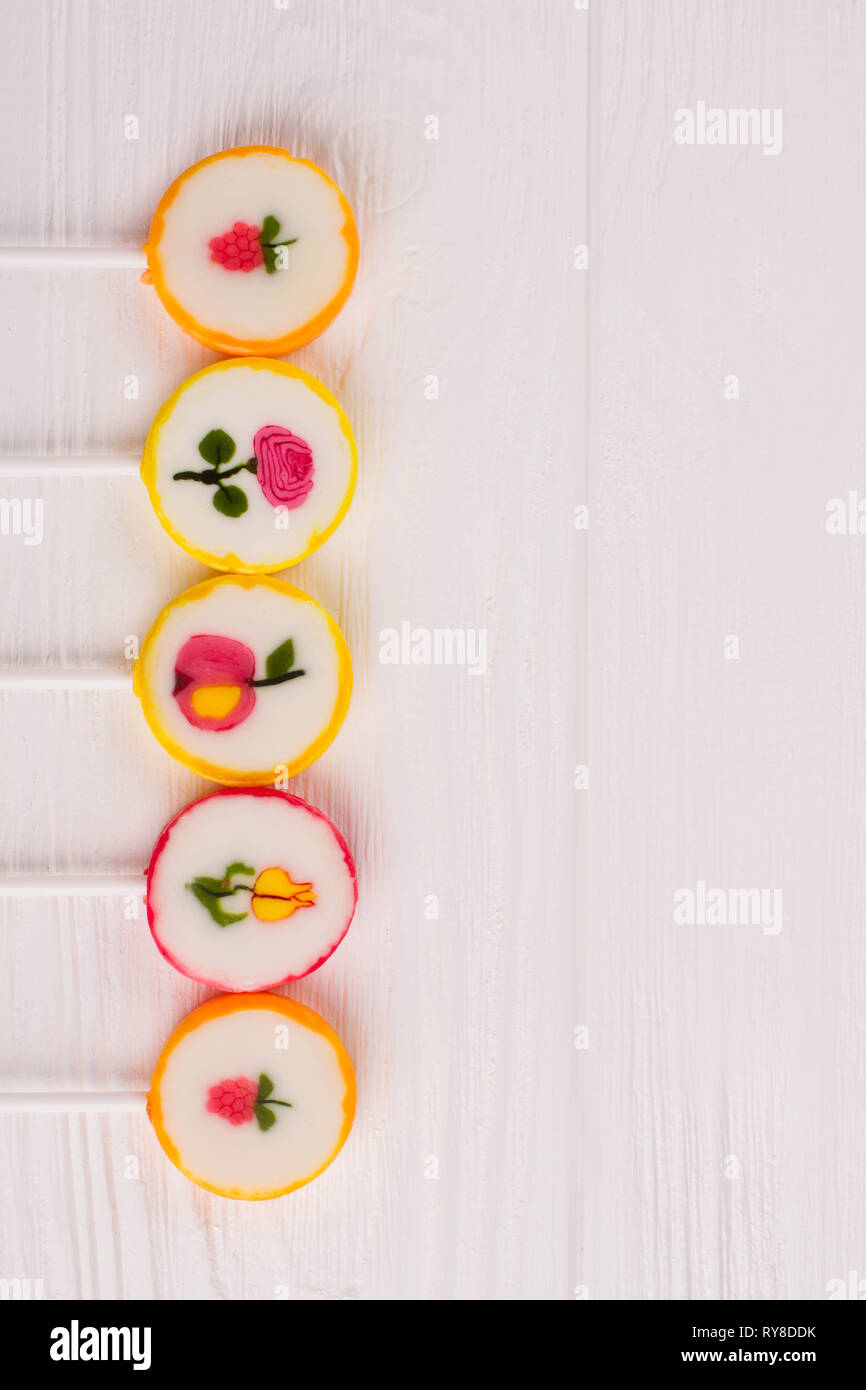 Colorful round lollipops with different fruits Stock Photo - Alamy