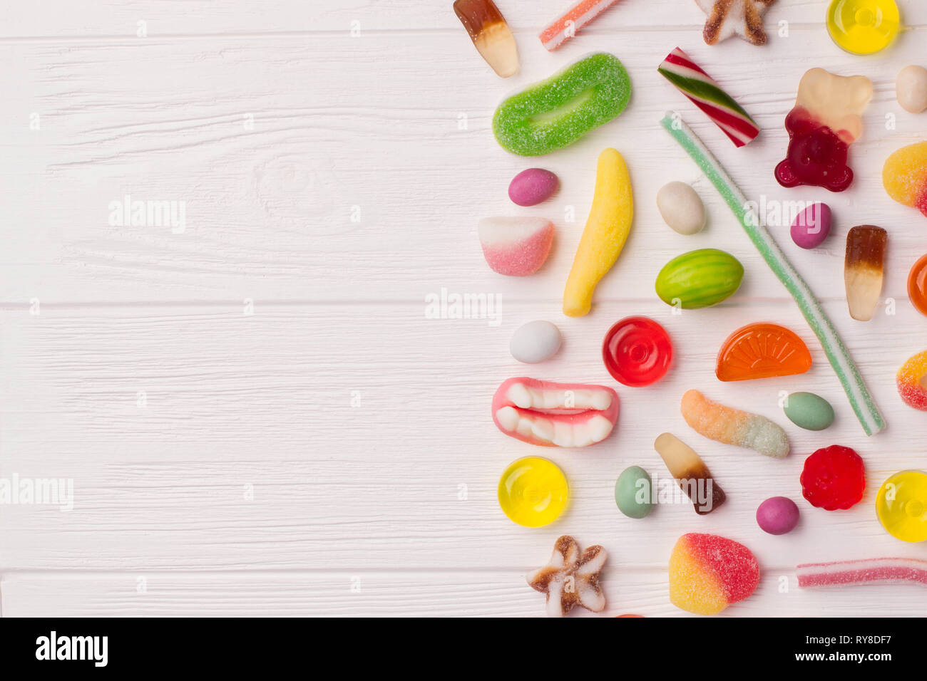Holiday background with multicolored sweets Stock Photo - Alamy