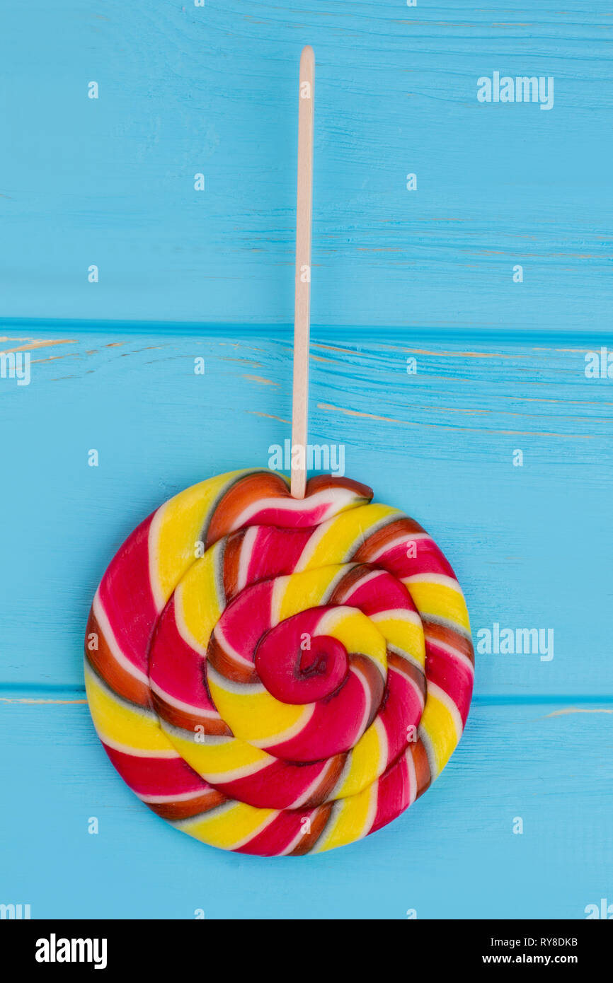 Colorful spiral lollipop candy on stick Stock Photo - Alamy