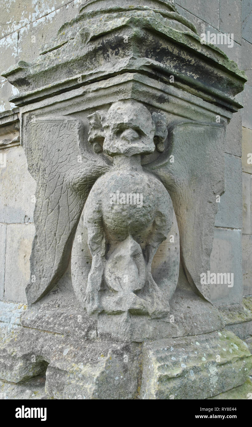 A Stone block showing winged gargoyle detail carved Stock Photo - Alamy
