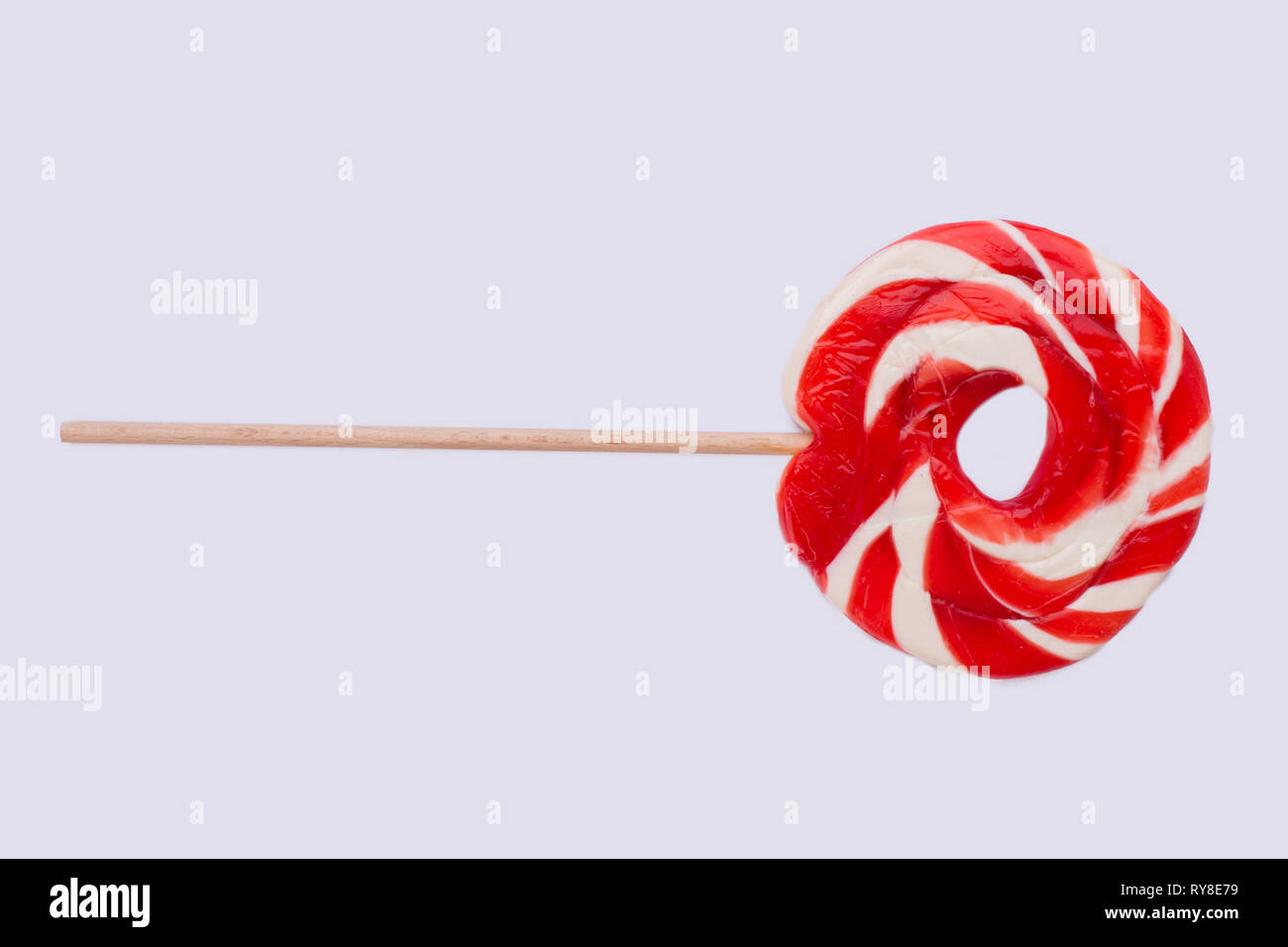 Red large lollipop isolated on white background Stock Photo - Alamy