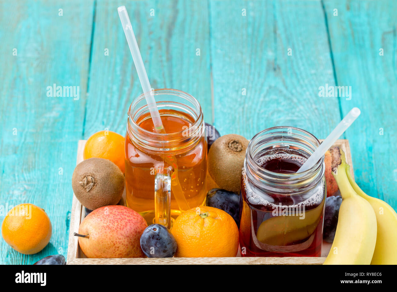 Glasses of juise with fruits on table Stock Photo - Alamy