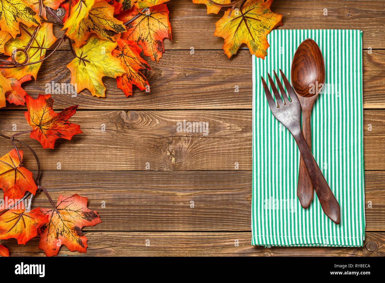 Wooden table with fork , spoon Stock Photo - Alamy