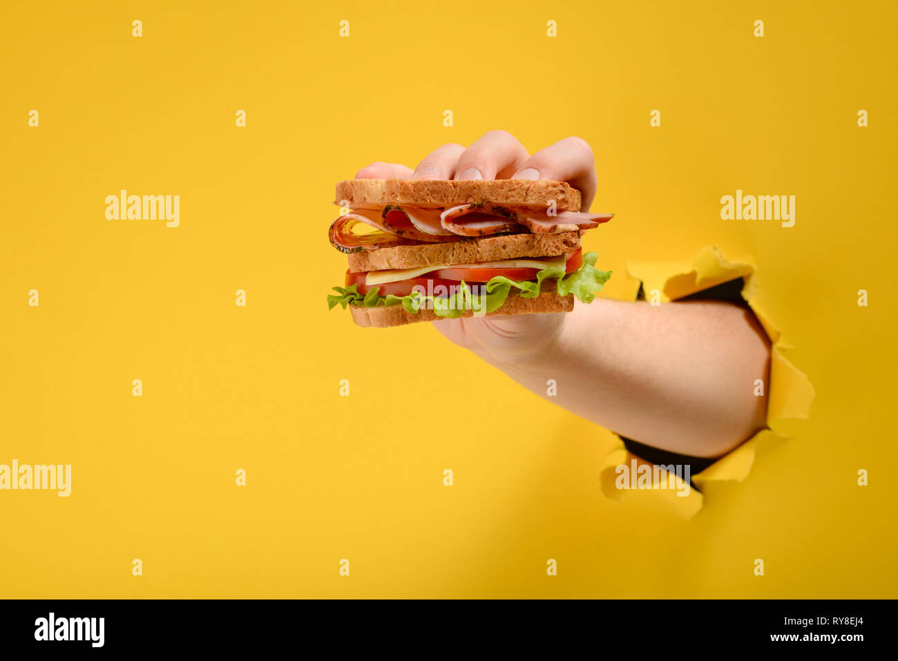 Hand to take a sandwich Stock Photo - Alamy