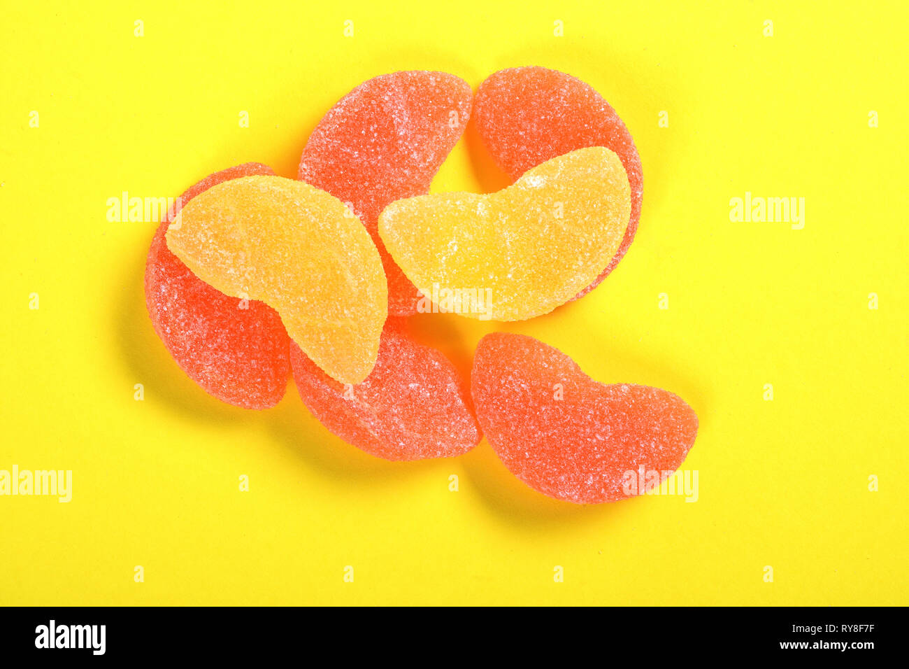 group of jelly candies piece of orange fruit color yellow and orange on ...