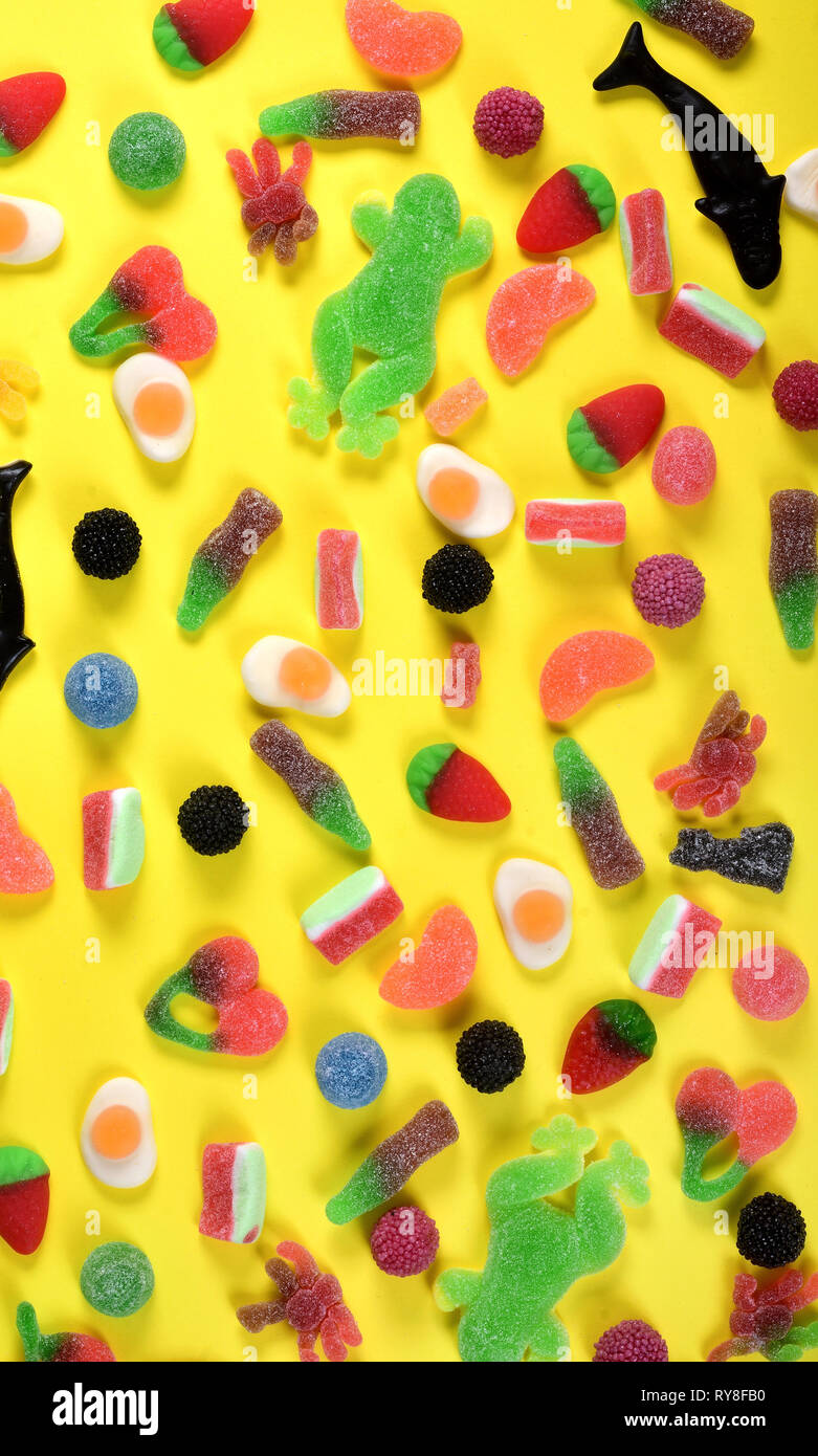 top view of jelly candies collection on yellow background Stock Photo ...