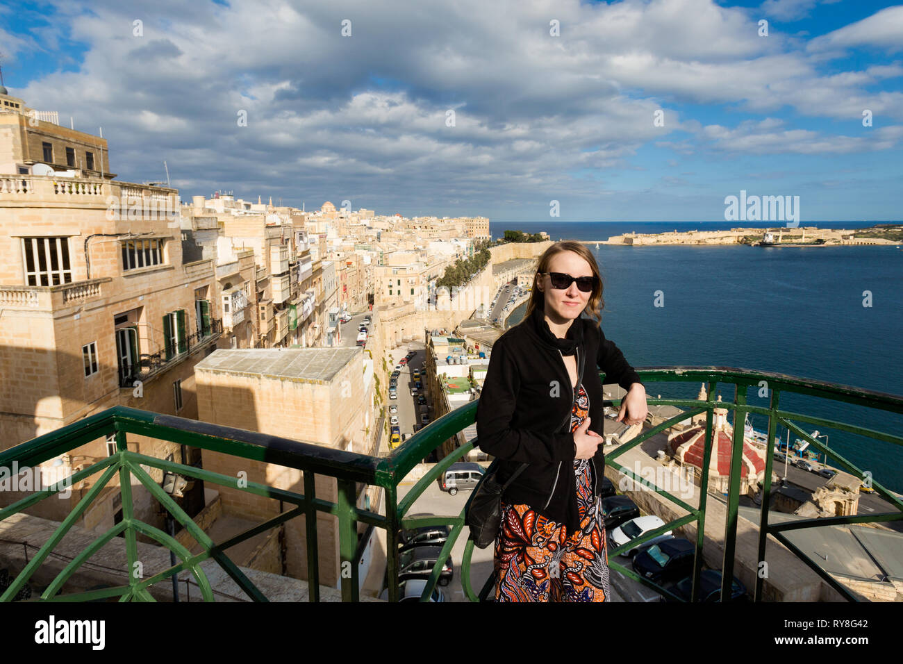 Tourist on Upper Barraka Gardens and beautiful sandstone architecture ...