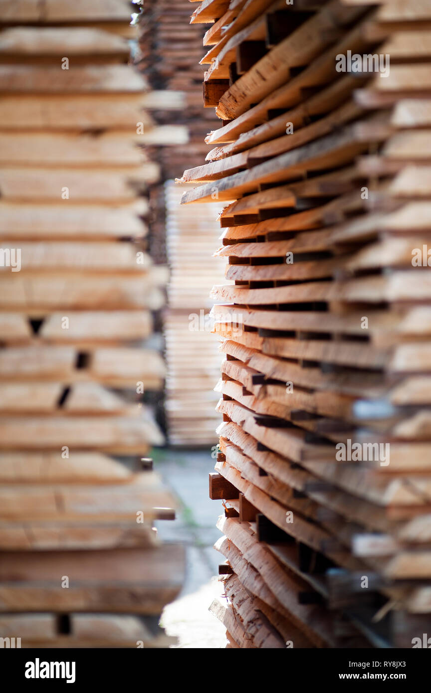Stacks of wood at depot Stock Photo - Alamy