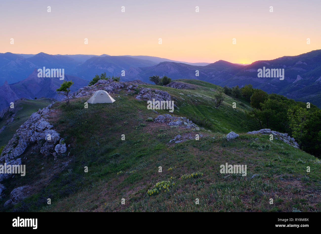 Mountain landscape with a beautiful sunset. Camping in the outdoors ...
