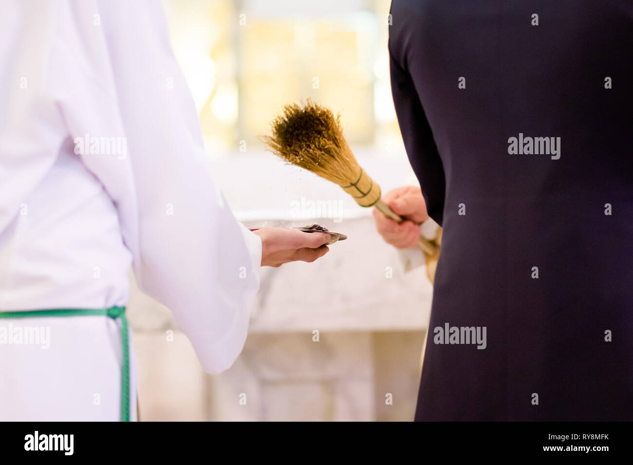 Christian detaill - Prist traditionally blessing wedding rings in ...