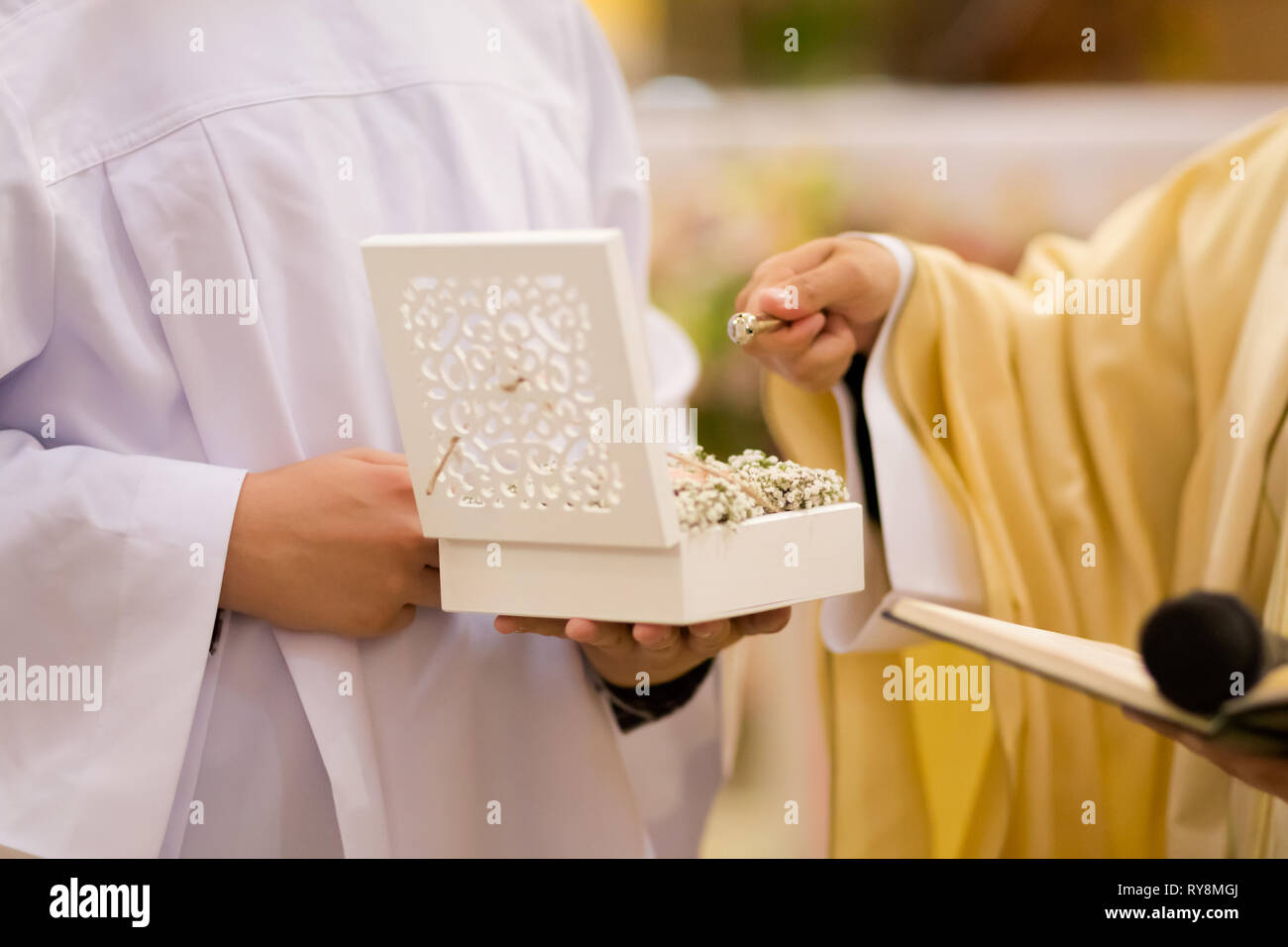 Christian detaill - Prist traditionally blessing wedding rings in ...