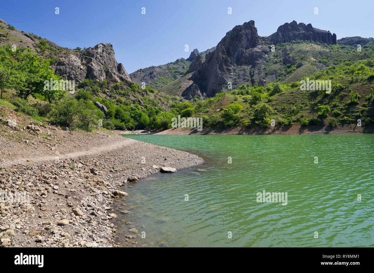 Summer landscape with beautiful lake in mountains. The peninsula of ...