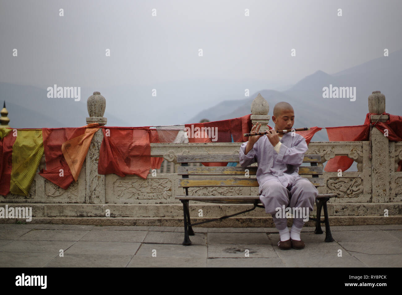 Little monk playing flute, Wutai Shan, Shanxi, China Stock Photo - Alamy
