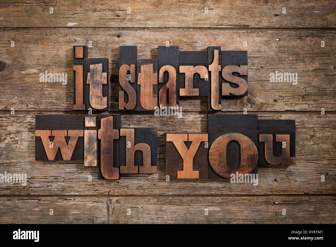 it starts with you, phrase writen with vintage letterpress printing ...