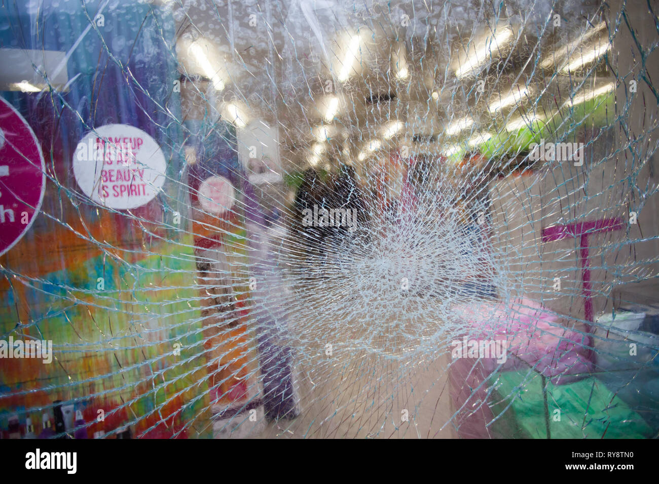 Smashed window to High street shop by vandals , trhreat of Lawlessness ...