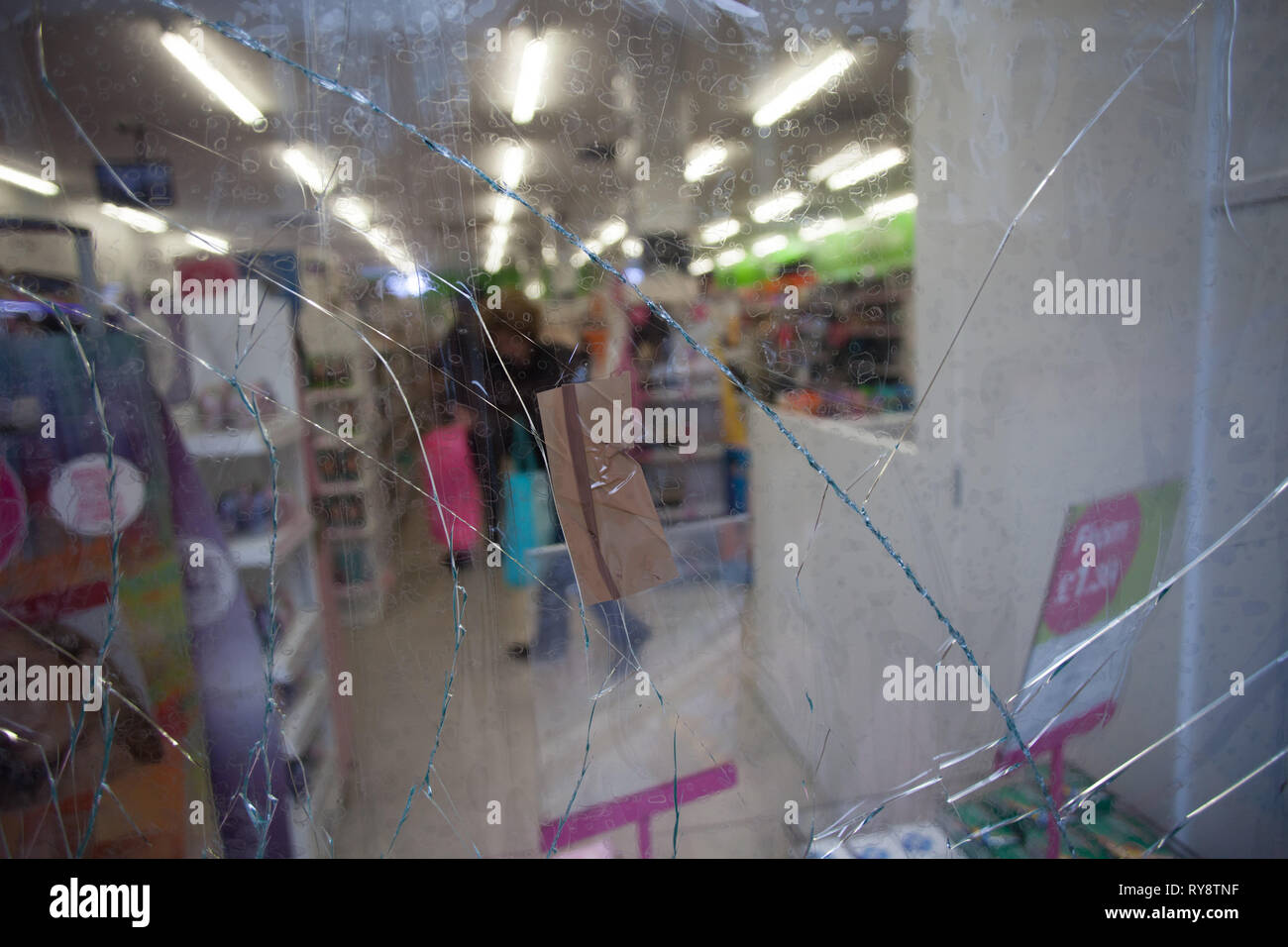 Smashed window to High street shop by vandals , trhreat of Lawlessness ...