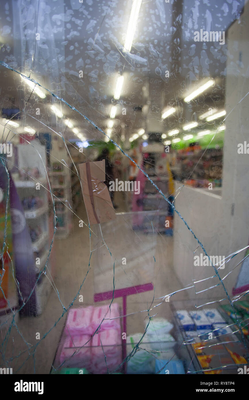 Smashed window to High street shop by vandals , trhreat of Lawlessness ...
