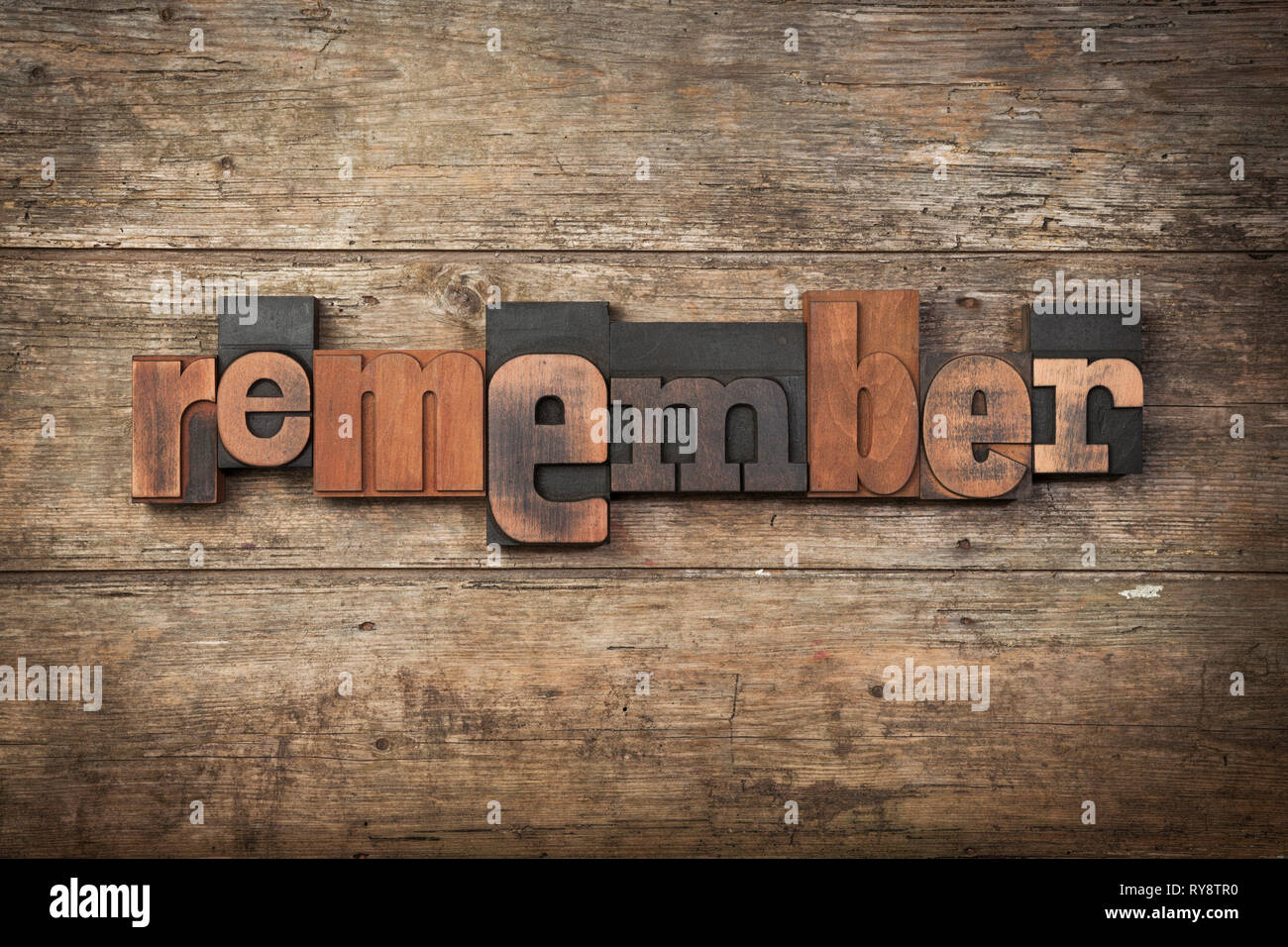 remember, set with old wooden printing blocks on rustic background ...