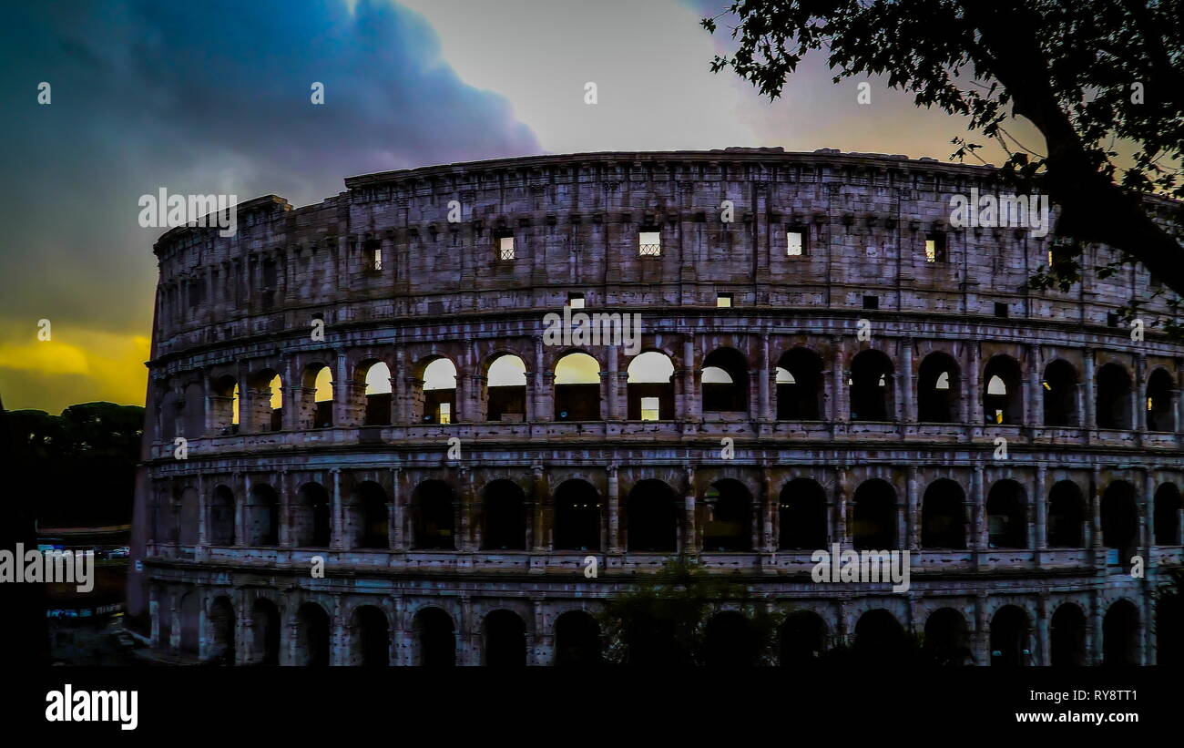 View of the Colosseum in Rome at night seen the windows of the ancient ...