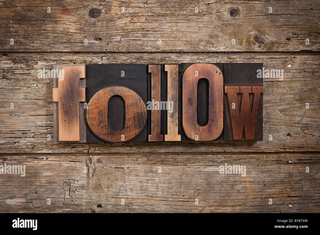 follow, word set with antique letterpress type on rustic wooden ...