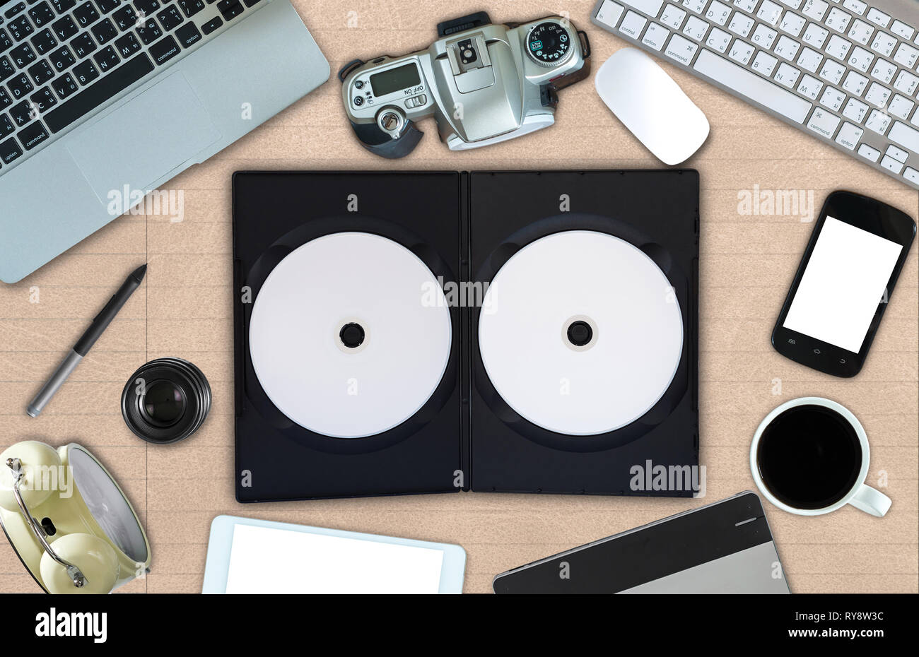 Top view of empty disk with cover and office accessory on paper ...