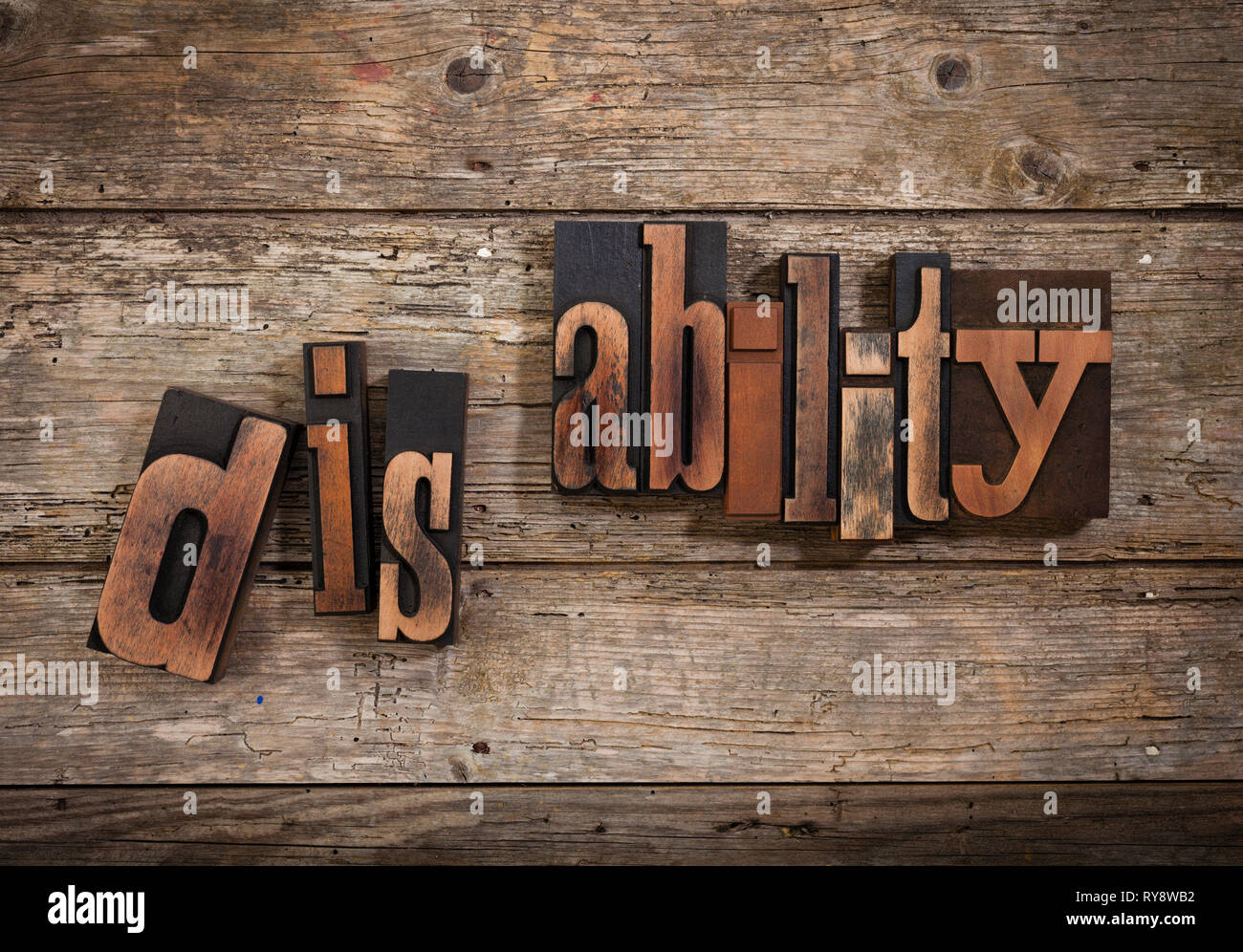 disability, split word set with vintage letterpress printing blocks on ...