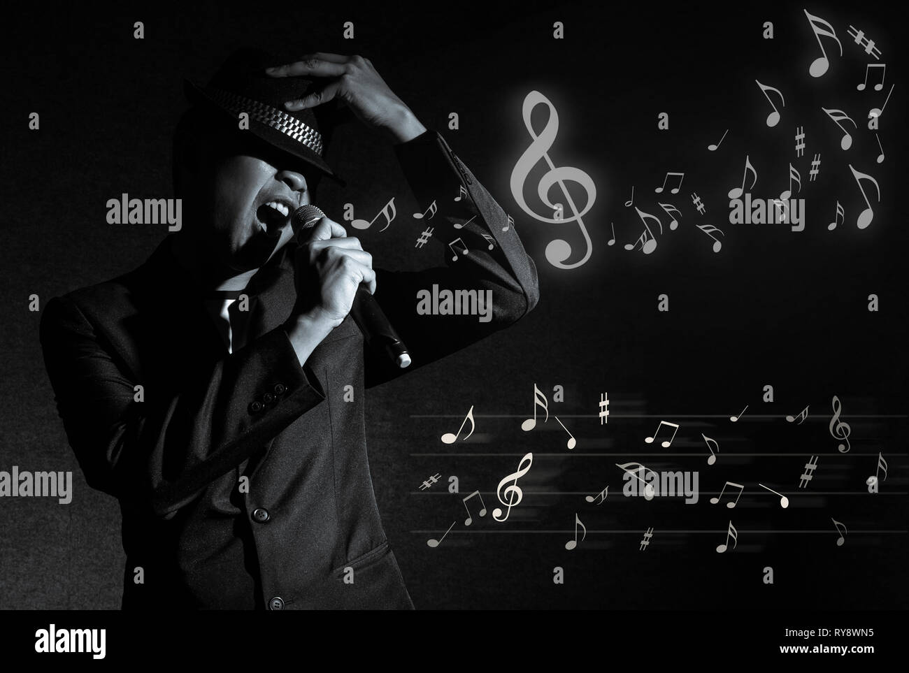 Songer hand holding the microphone and singing with music notes on ...