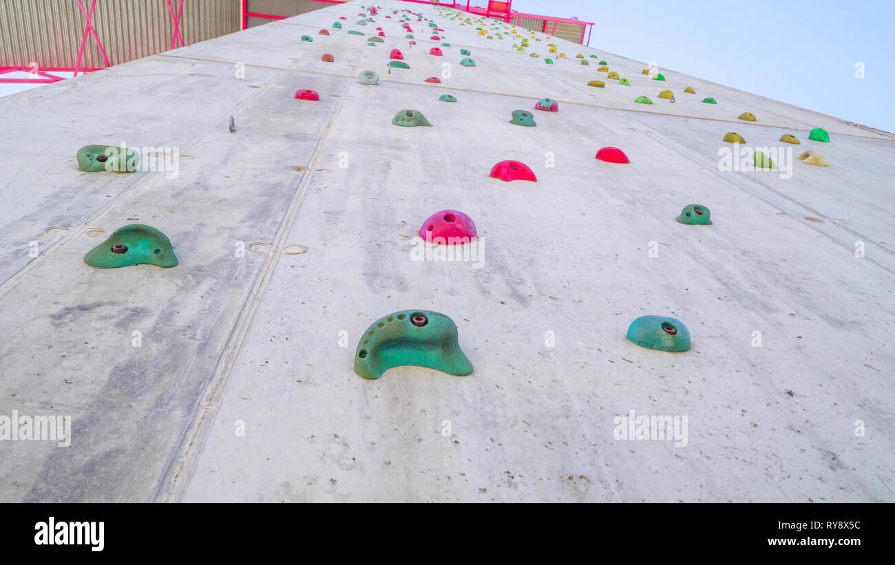The wall climbing sport for recreation outdoor with the colorful steps ...