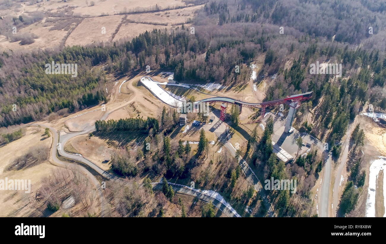 A big slide for ski jump in Tehvandi Otepaa Estonia with the tall trees ...