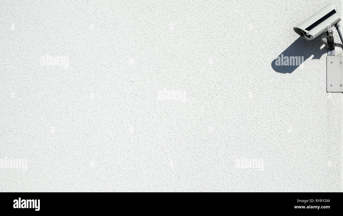 CCTV. Surveillance camera on concrete wall. Blank empty copy space for ...