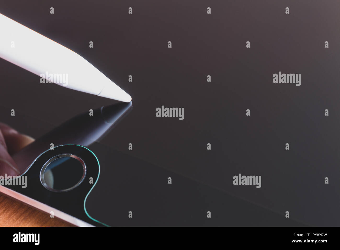 Apple Pencil 2015 1st generation touching iPad Pro black screen Stock ...