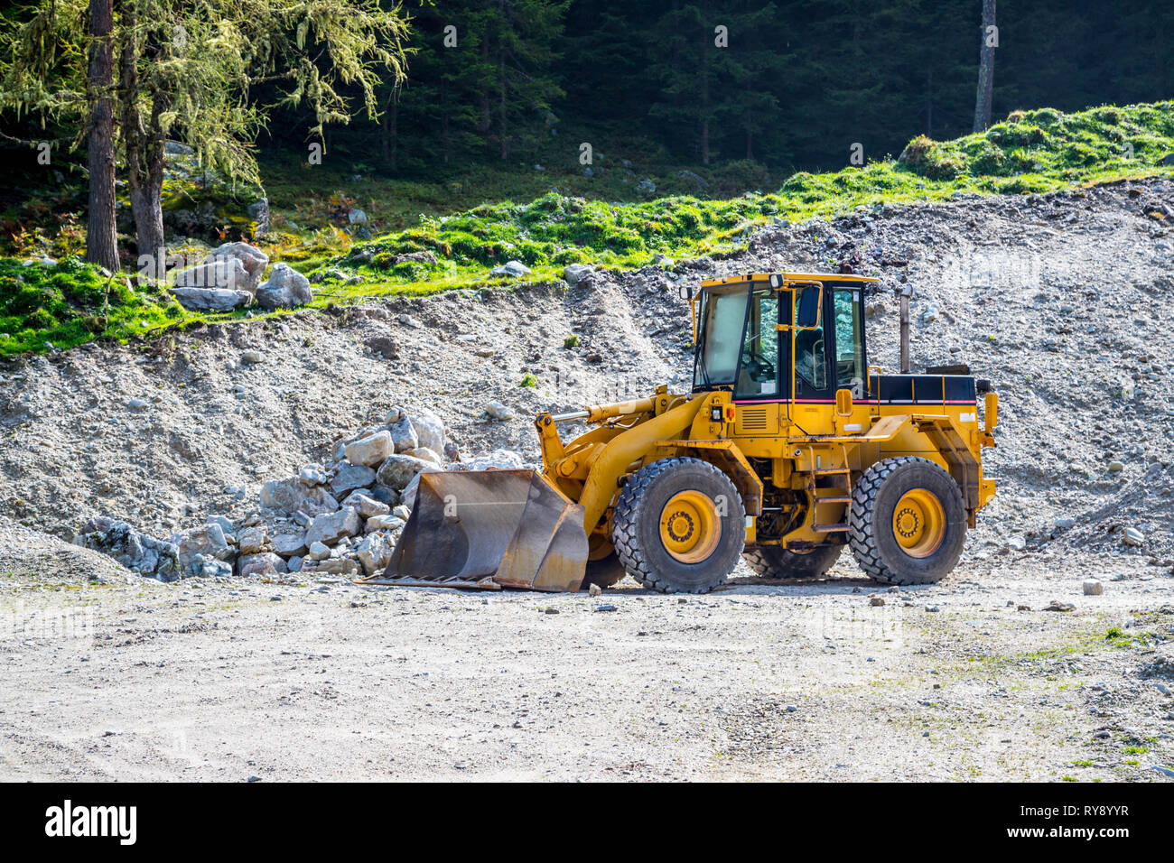 Wheel loader excavator is parking in a quarry Stock Photo - Alamy