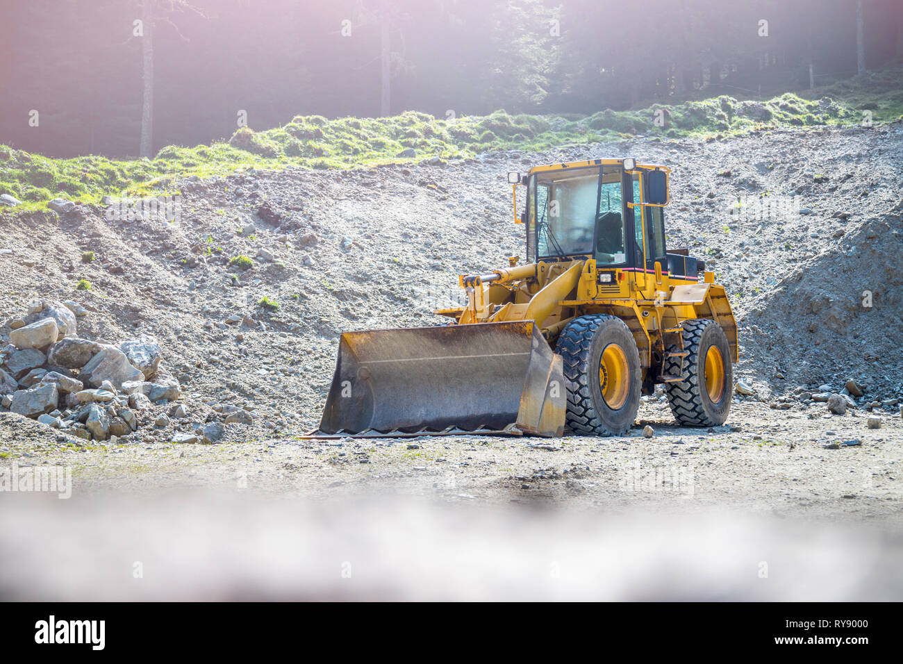 Wheel loader excavator is parking in a quarry Stock Photo - Alamy