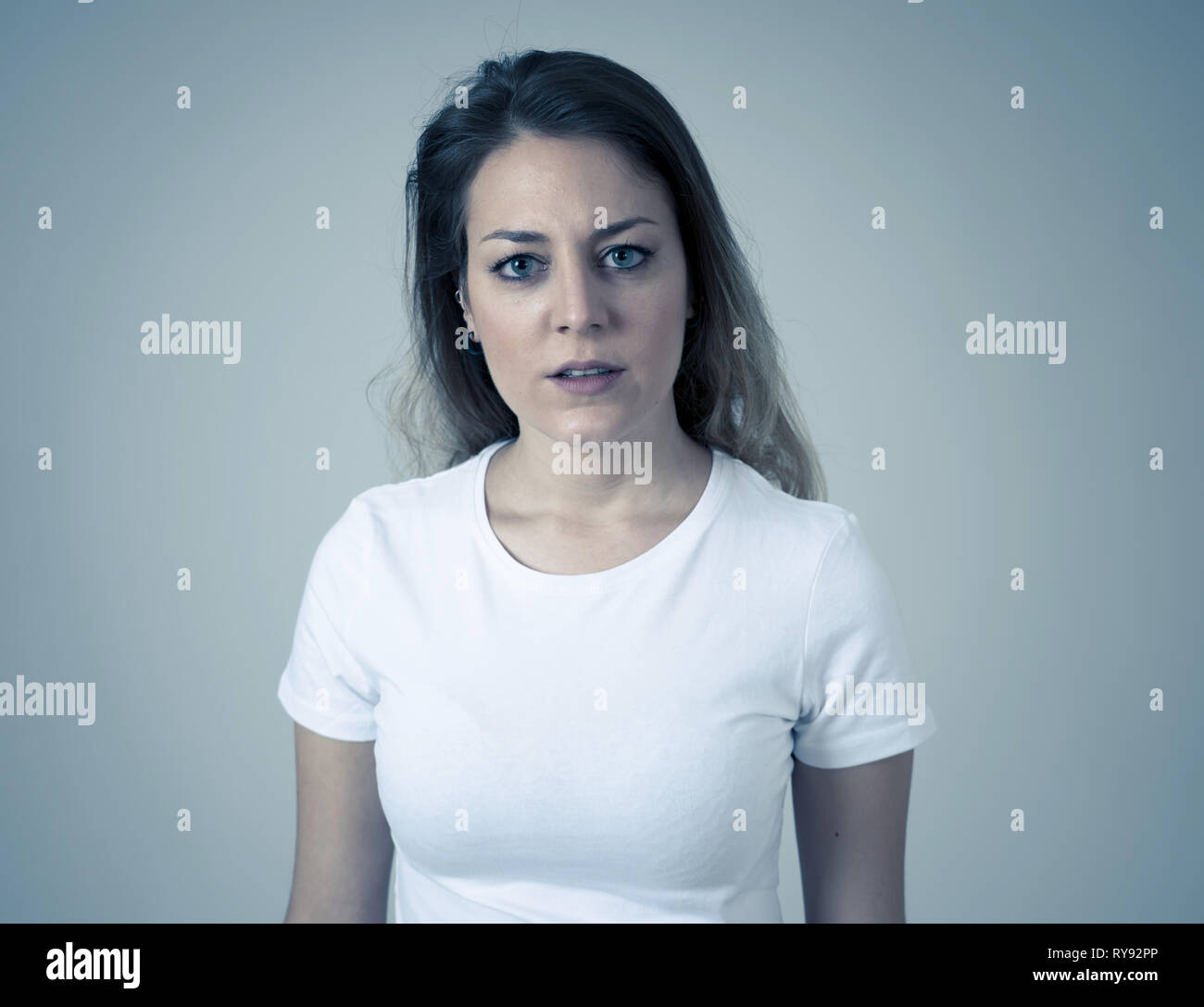 Close up portrait of young attractive caucasian woman with an angry ...