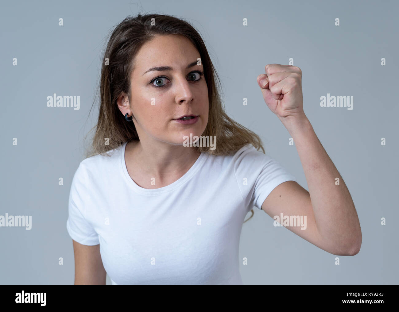 Close up portrait of young attractive caucasian woman with an angry ...