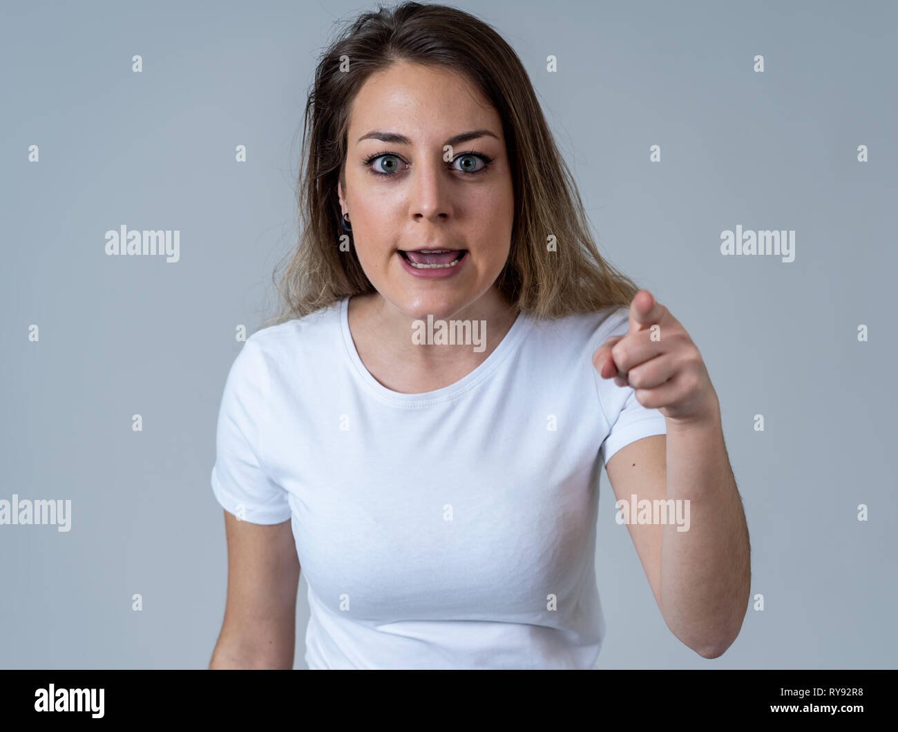 Close up portrait of young attractive caucasian woman with an angry ...