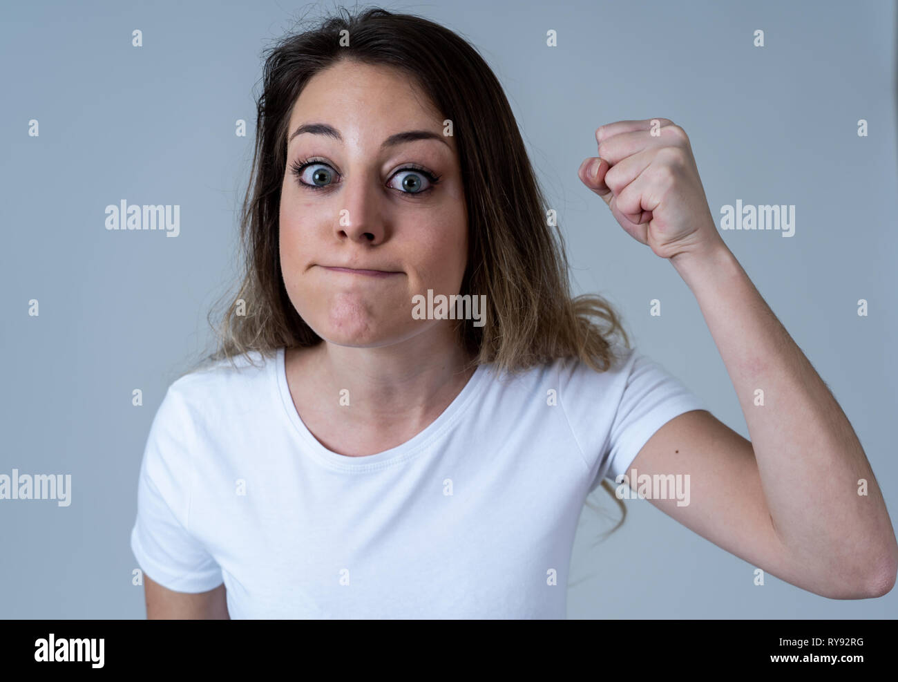 Close up portrait of young attractive caucasian woman with an angry ...
